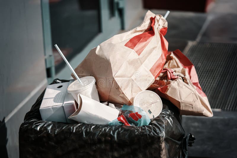 Bunch of Paper Packets and Cups of Coffee and Other Drinks in Garbage ...