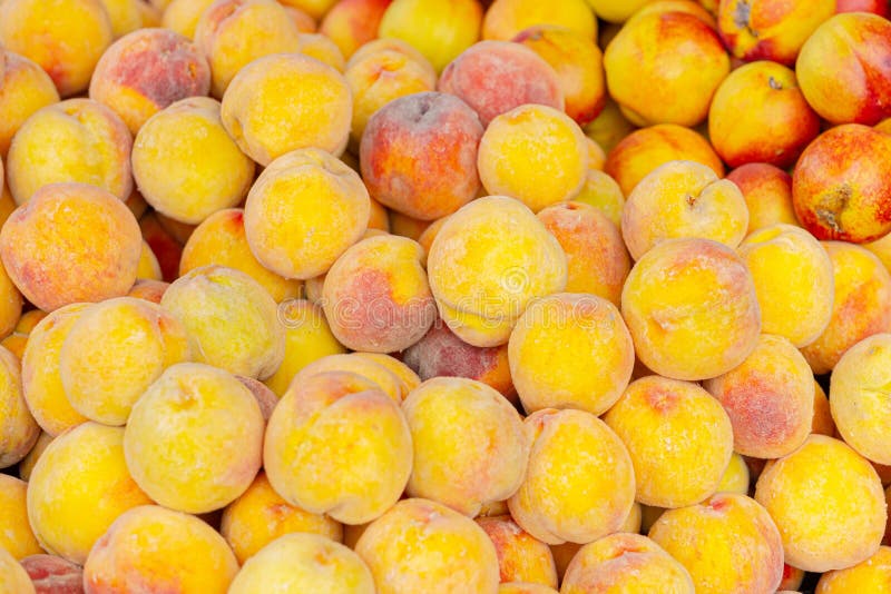 A Bunch of Peaches are Stacked on Top of Each Other. Stock Photo ...