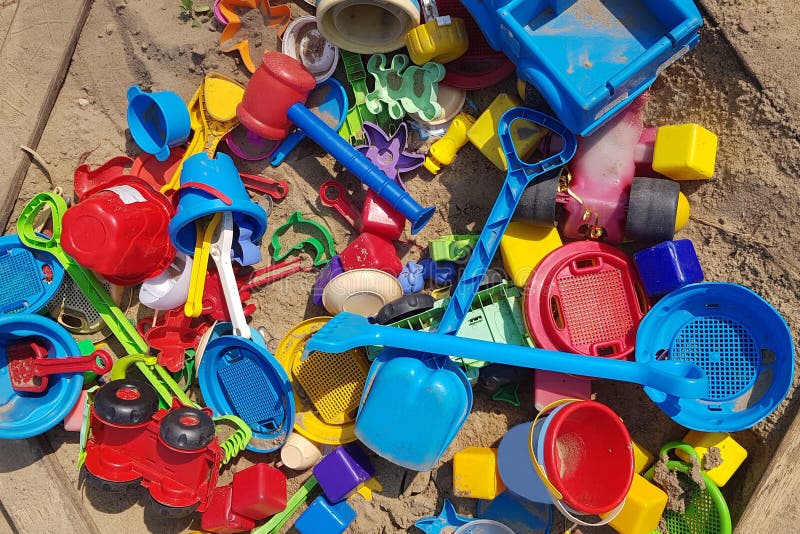 A Bunch of Plastic Toys Thrown in a Sandbox Stock Image - Image of ...