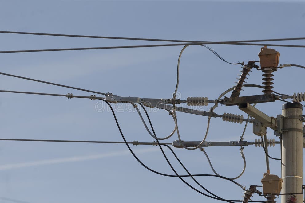 A Bunch of Power Lines are Connected To a Tall Utility Pole Stock Photo ...