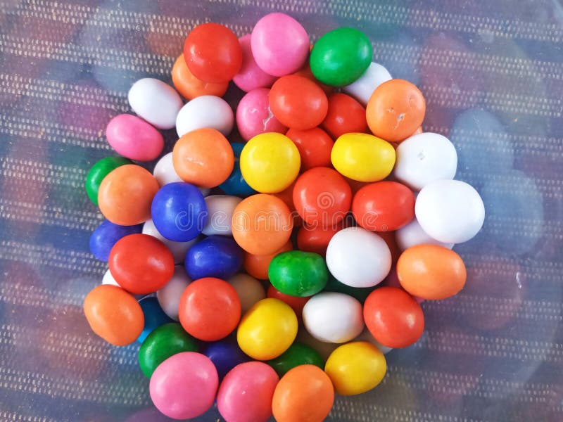 Bunch of Rainbow Sugar Coated Round Chocolate Balls in Plastic ...