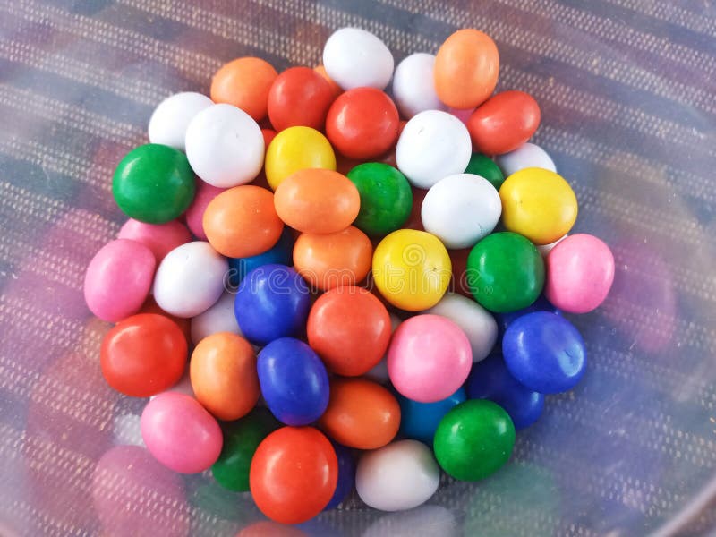 Bunch of Rainbow Sugar Coated Round Chocolate Balls in Plastic ...