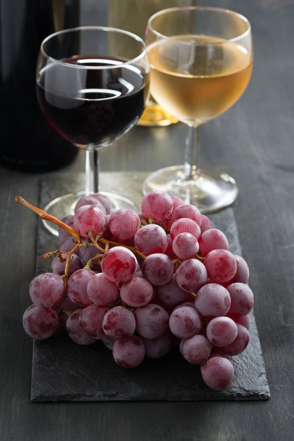 Bunch Of Red Grapes, Wine Glasses With Red And White Wine Stock Photo ...