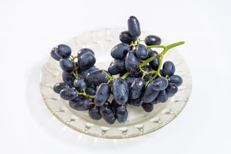 Bunch of Seedless Black Grape on a Plate,seasonal Fruit Isolated on ...