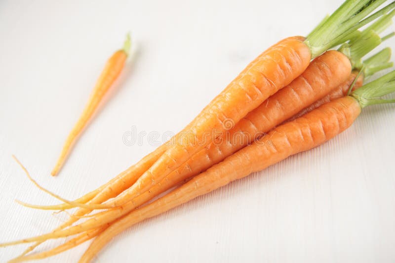Bunch of small carrot stock image. Image of young, board - 25551383