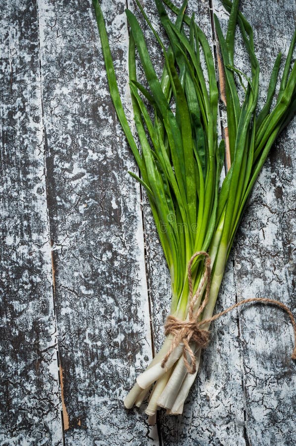 Bunch of Spring Onion on a Wood Table Stock Photo - Image of eating ...