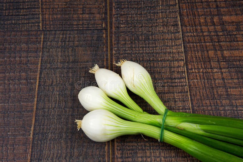 Bunch of Spring Onions on Wooden Background Stock Photo - Image of ...