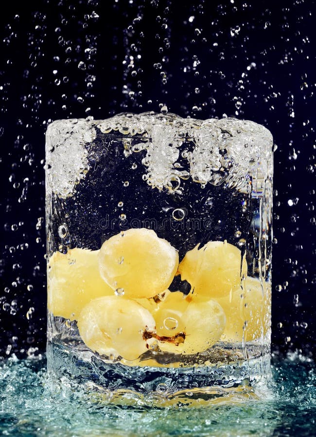 Bunch of White Grapes Falling Down in Water Glass Stock Photo - Image ...