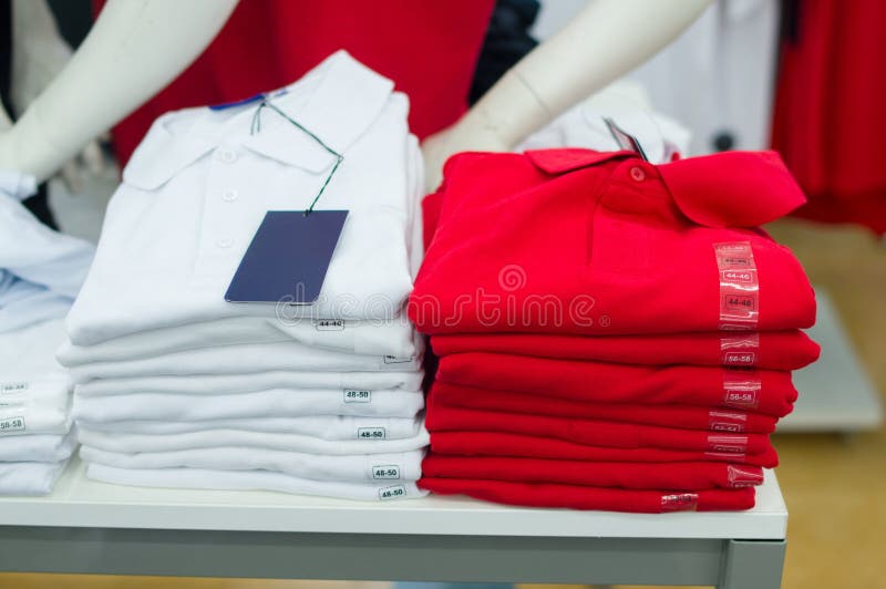 Bunch of White and Red Polo Shirts on Table Stock Image - Image of ...