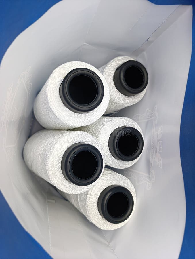 A Bunch of White Spools of Thread in a White Bag Stock Photo - Image of ...