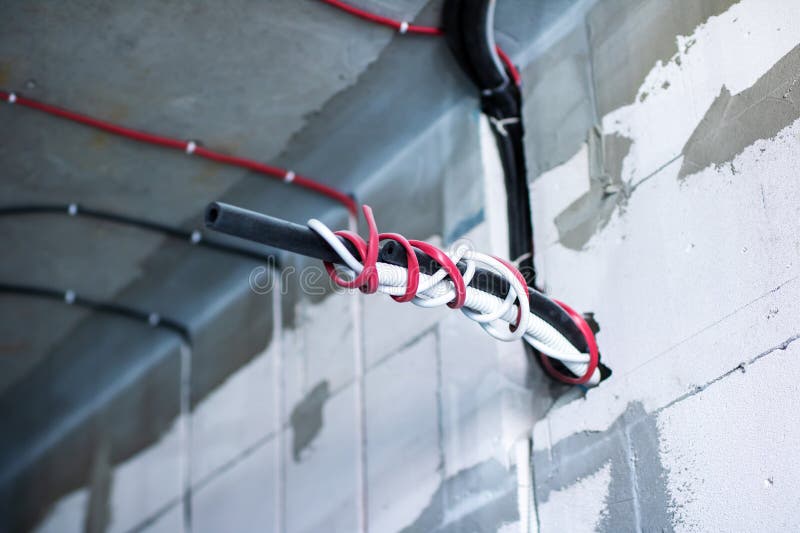 A Bunch of Wires and Cables are All Connected To a Wall Socket Stock ...