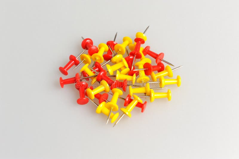 Bunch of Yellow and Red Office Buttons on Gray Stock Photo - Image of ...