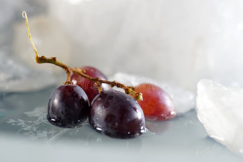 Bunches of Grapes in Ice Water with Colorful Flashes Photographed in ...