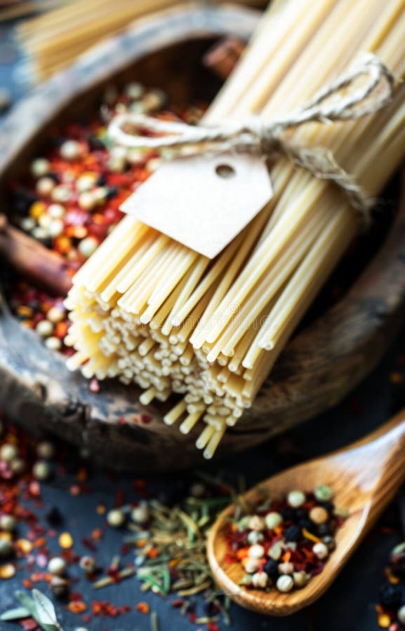 Bundle of Dried Spaghetti Tied with String on a Rustic Wooden Surface ...