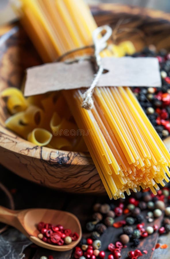 Bundle of Dried Spaghetti Tied with String on a Rustic Wooden Surface ...
