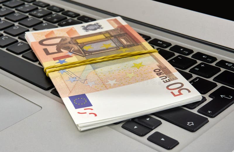 A Bundle of 50 Euro Bills Lying on a Computer Keyboard Stock Photo ...