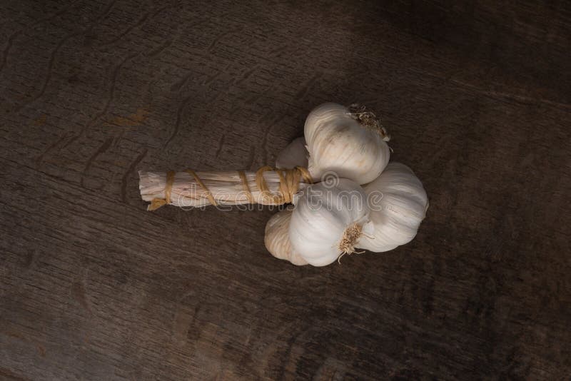 Bundle of Garlic on a Grey Stone Surface Stock Image - Image of bundle ...