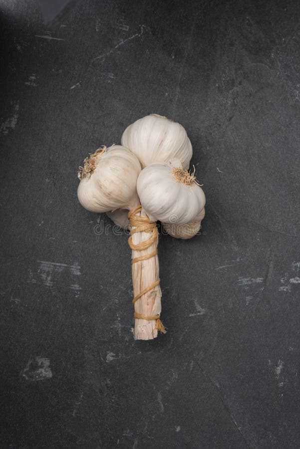 Bundle of Garlic on a Grey Stone Surface Stock Photo - Image of ...