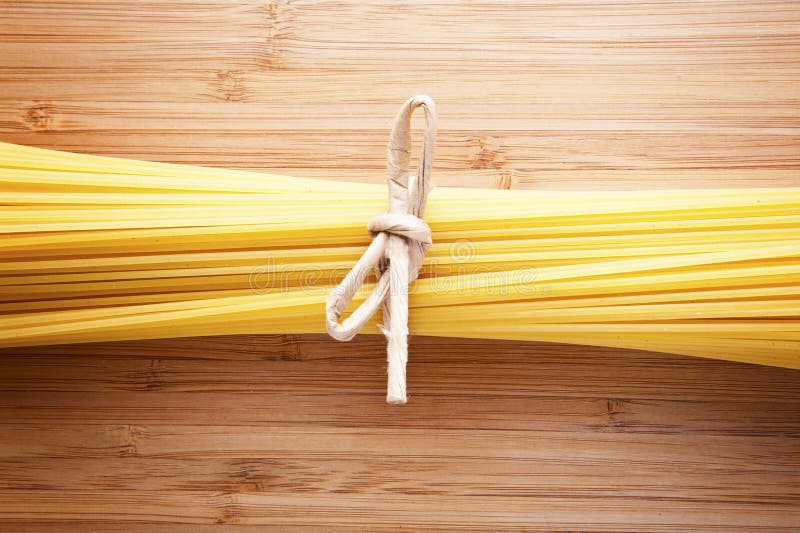Bundle of Italian Spaghetti Pasta Tied with String Lying on Old Stock ...