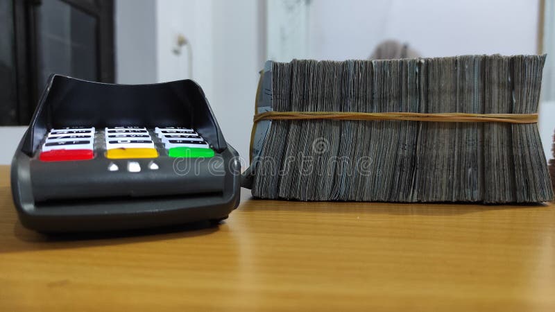 A Bundle of Money Next To Electronic Data Capture or EDC Stock Photo ...