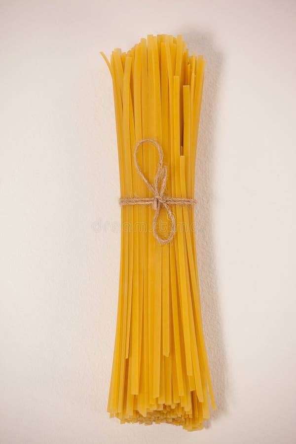 Bundle of Raw Spaghetti Tied with Rope Stock Photo - Image of meal ...