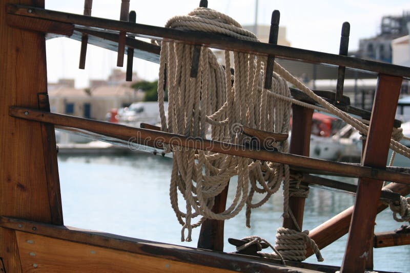 Bundle of Rope on Wooden Boat Side Stock Photo - Image of harbor, boat ...
