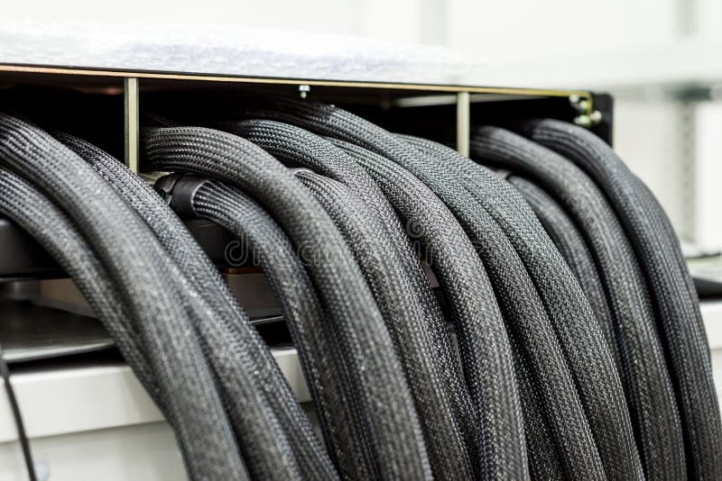 A Bundle of Thick Cables in Plastic Sheath. a Lot of Cables Enter the ...