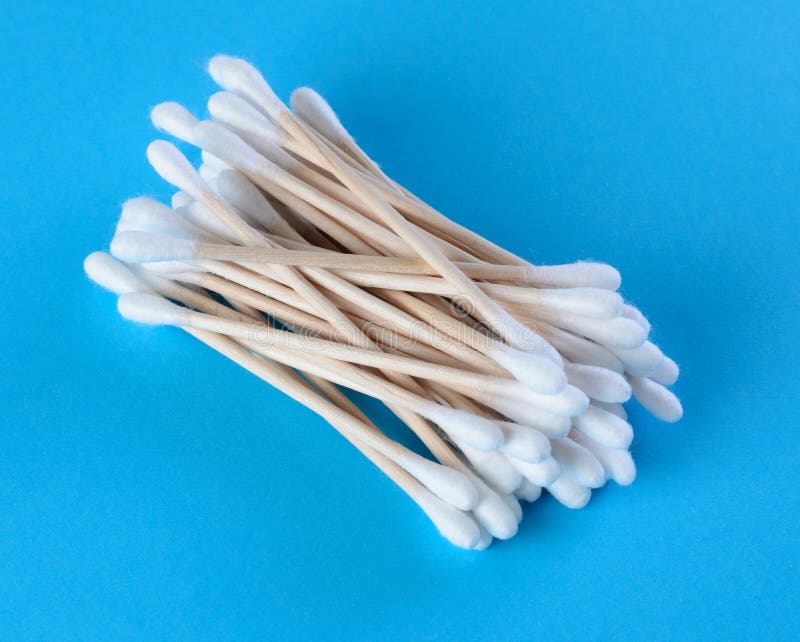 Bundle of White Cotton Swabs on Solid Blue Background Stock Photo ...