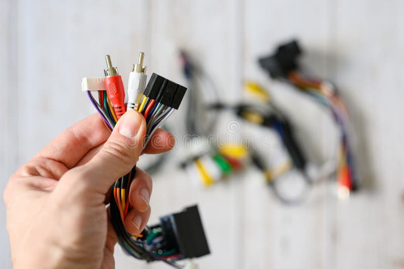 A Bundle of Wires with Different Connections in a Hand Against a ...
