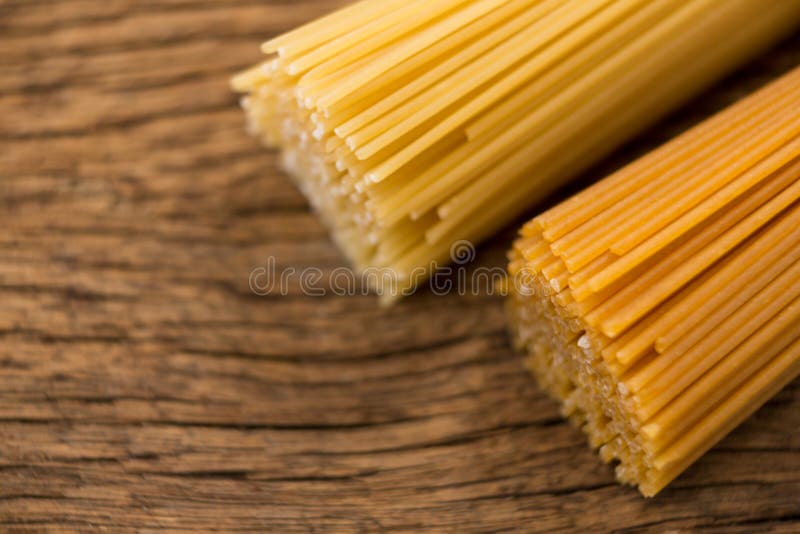 Bundles of raw spaghetti stock photo. Image of meal, staple - 88947226