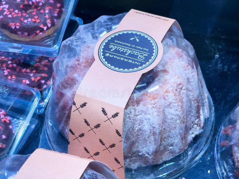 Bundt Cake with Pink Sugar Coating Displayed in Plastic Packaging ...