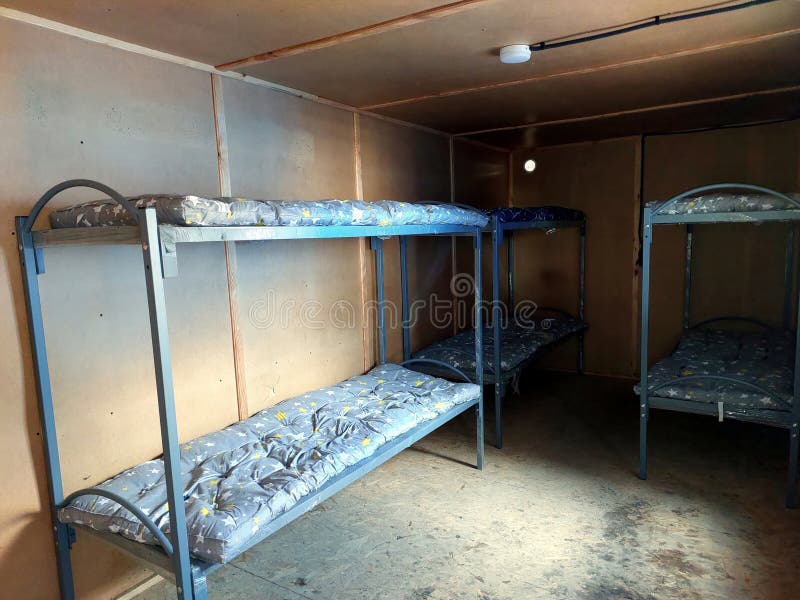 Bunk Beds Arranged in a Compact Living Space with Simple Decor and ...