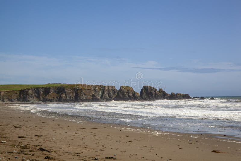 Bunmahon Beach stock image. Image of clouds, island - 201681283