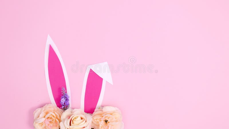 Bunny Ears Appear with Bloom Spring Arrangement on Pastel Pink ...