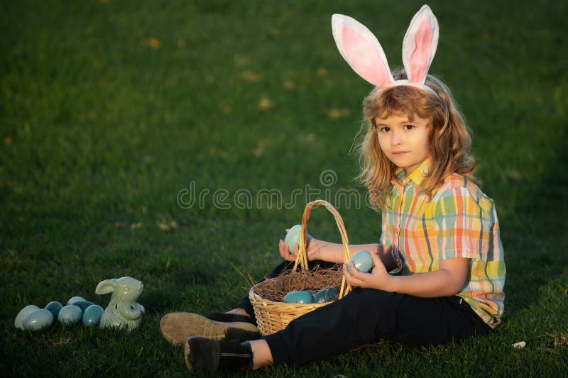 Bunny Kids with Rabbit Bunny Ears. Child Boy Hunting Easter Eggs in ...