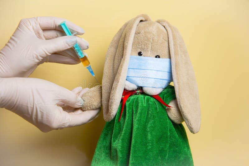 A Bunny in a Mask is Given an Injection. Vaccination Stock Photo ...