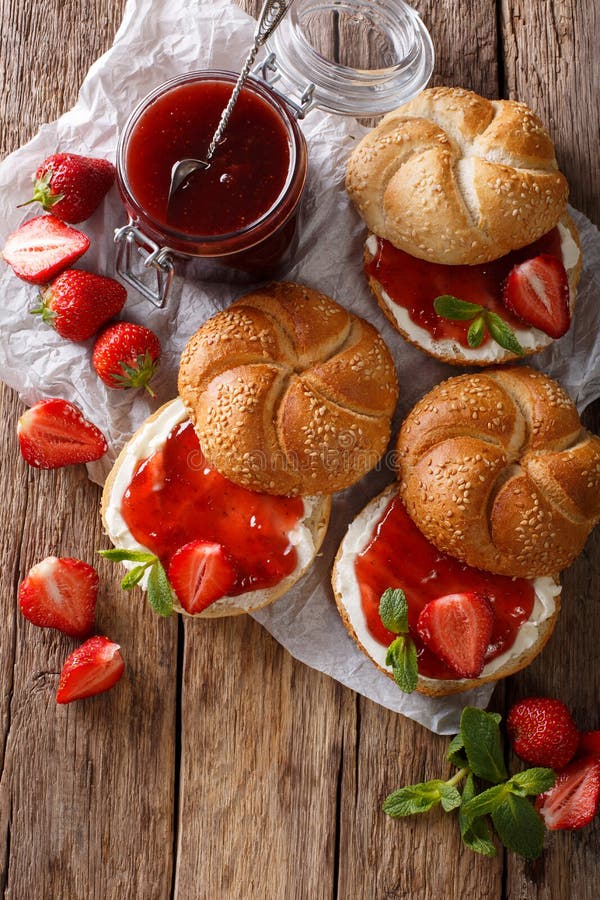 Buns for Breakfast with Strawberry Jam, Cream and Mint Closeup. Stock ...