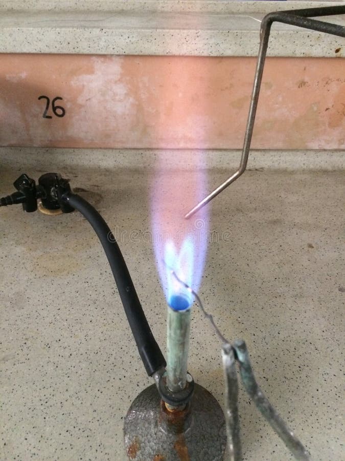 Bunsen Burner with Copper Wire Splitting Blue Flame in Half Stock Photo ...