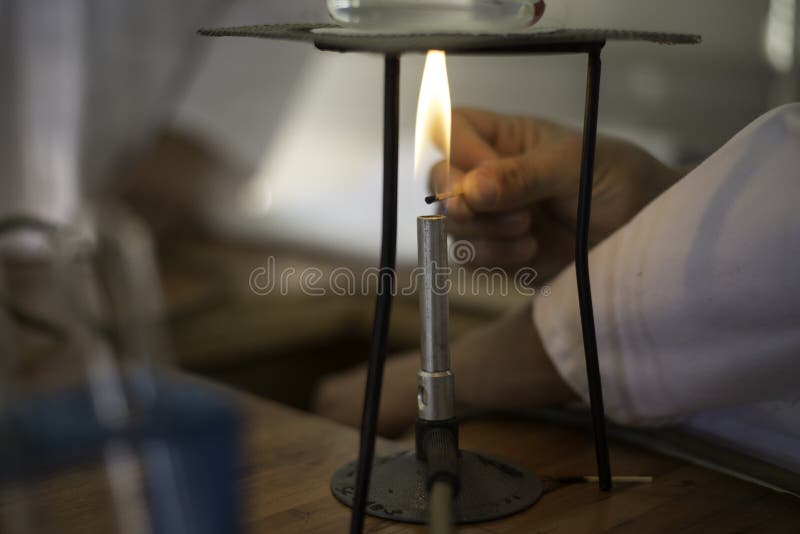 Bunsen Burner Heating Flask With Science Equipment In Laboratory Stock ...