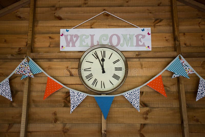 Buntin and Welcome Sign with a Clock Stock Image - Image of party ...