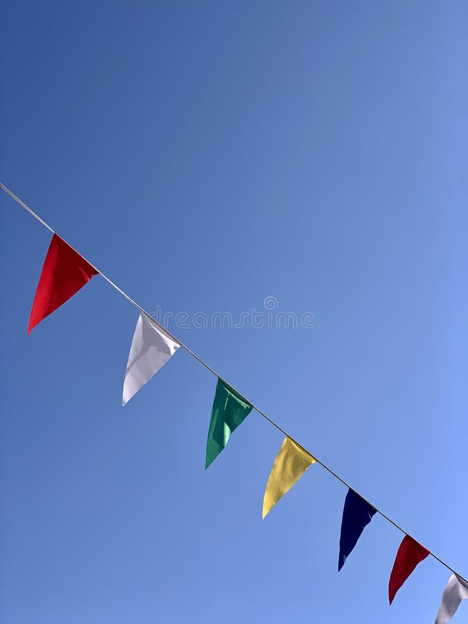 Bunting with Colorful Triangular Flags Against Blue Sky Stock Image ...