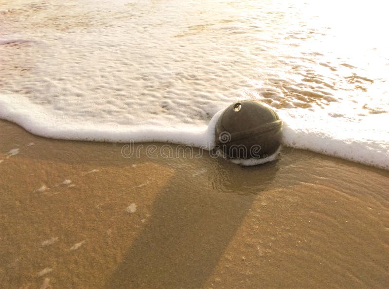 The Buoy on the Beach and Hit the Waves. Stock Image - Image of ...