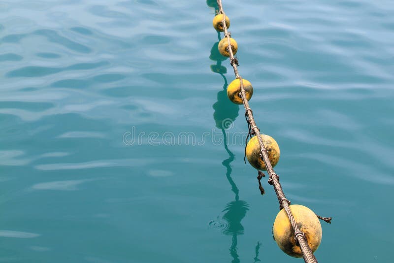 Buoys and deep blue sea stock photo. Image of safety - 46661140