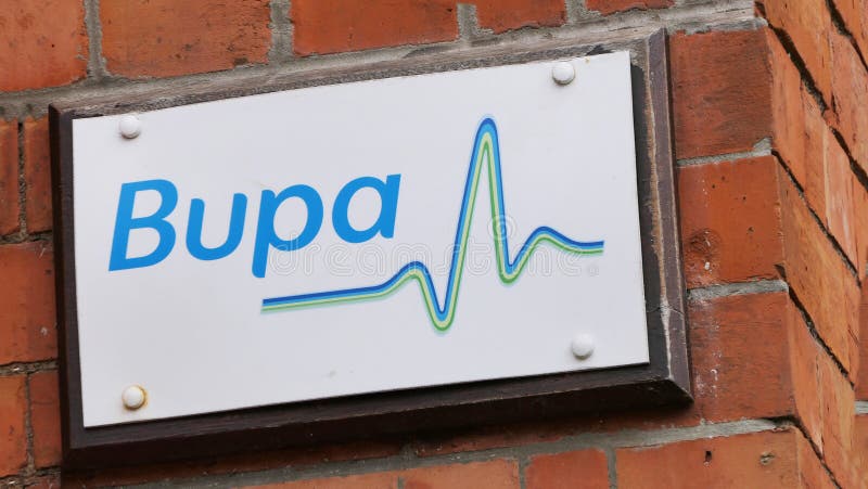 Bupa sign on brick wall editorial photography. Image of hospital ...