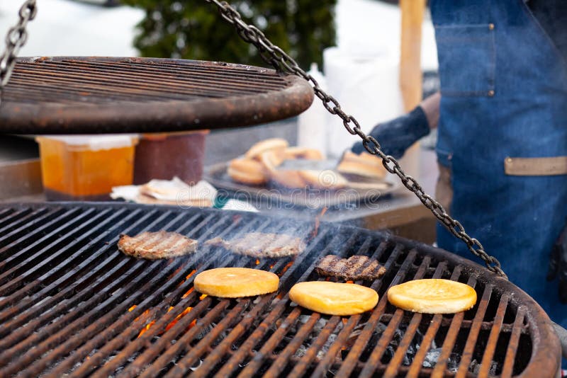 Burger Barbeque Being Cooked on a Flame Stock Photo - Image of gloves ...