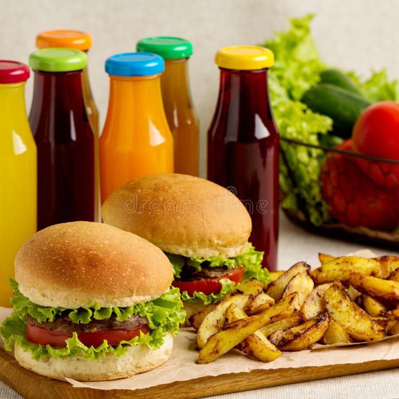 Burger with Beef, Tomato and Herbs. Fries and Juice Stock Image - Image ...