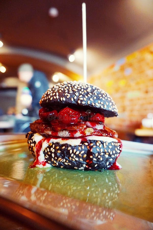 Burger with cherry jam stock photo. Image of tasty, cherry - 169702542
