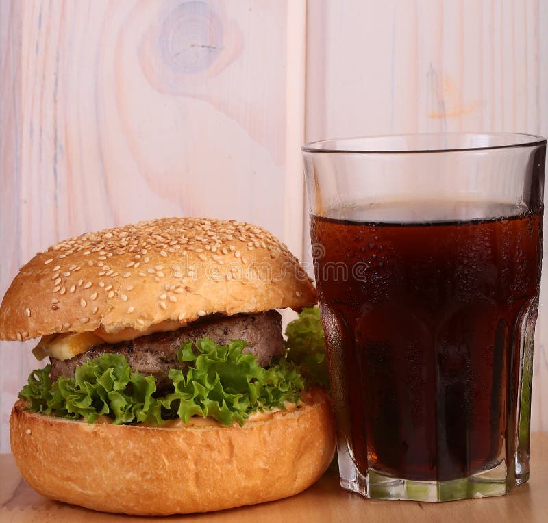 Burger and cola stock photo. Image of calorie, diet, grilled - 61059902 Burger and cola stock photo. Image of calorie, diet, grilled - 61059902