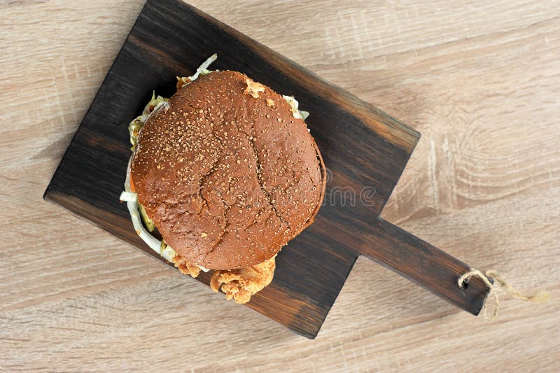 Burger with Dark Bread on Wood Board Stock Image - Image of lunch, beef ...