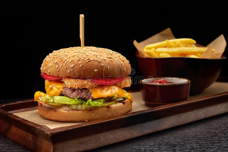 Burger with a Double Patty, Cheese and Tomatoes Stock Photo - Image of ...